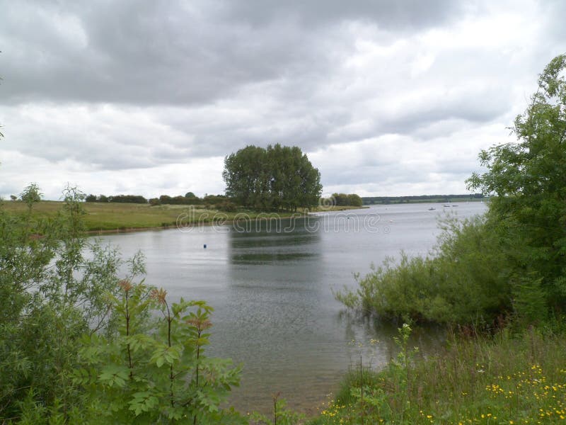 Rain Clouds Over Lake Landscape Stock Image - Image of moving, rain ...