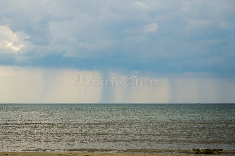 Rain Clouds and Rain Over the Sea Stock Photo - Image of cloudscape ...