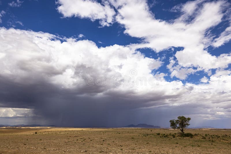 Rain from Cumulus Clouds in the Desert Stock Photo - Image of mountain ...