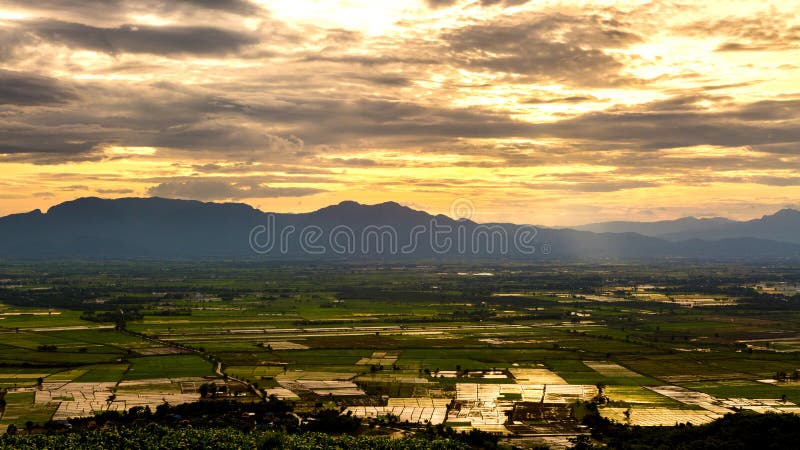 Rain Curtaining a View of the Mountains.Rain Storm Over Rice Fie Stock ...