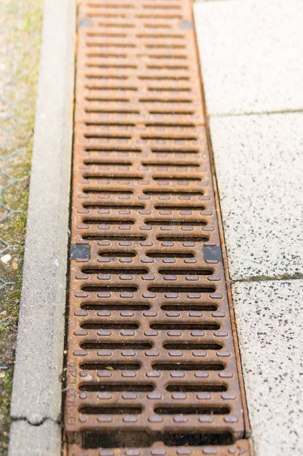 Rain drain stock image. Image of rain, sidewalk, road - 39340137