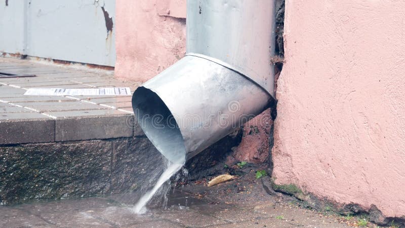 Rainwater Drainage System Flowing Gracefully from PVC Pipe on a ...