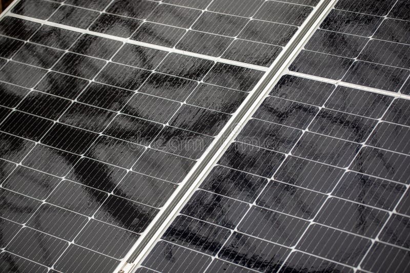 Rain-Drenched Black Solar Panels Generating Renewable Energy Stock ...