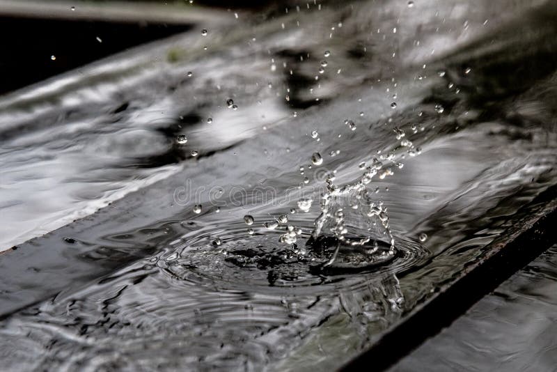 Rain Drop Splash in Wooden Floor Bouncing and Shaping a Water Crown ...