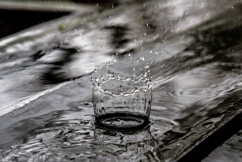 Rain Drop Splash in Wooden Floor Bouncing and Shaping a Water Crown ...