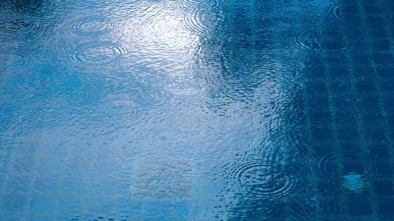 Rain Drop on the Surface of Swiming Pool. Stock Image - Image of liquid ...