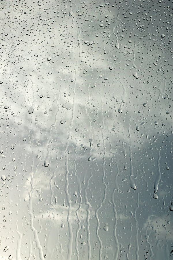 Rain Droplets Cascade Down Glass Window Stock Image - Image of moisture ...