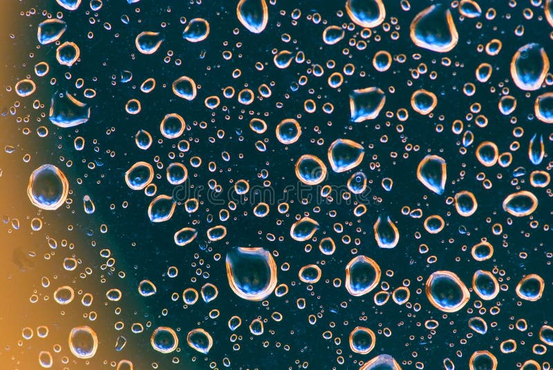 Golden Amber Water Drops stock image. Image of drink, shape - 4683827