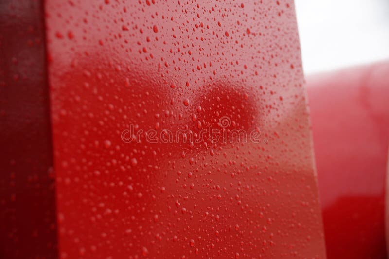 Rain Drops on a Surface of Red Color Stock Photo - Image of ...