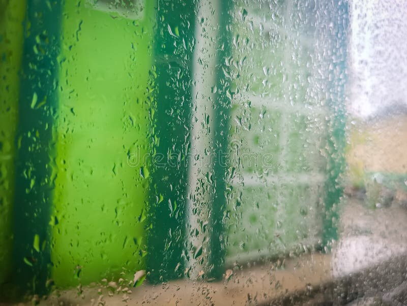 The Rain Drops Become Water Droplets on the Window Pane Stock Photo ...