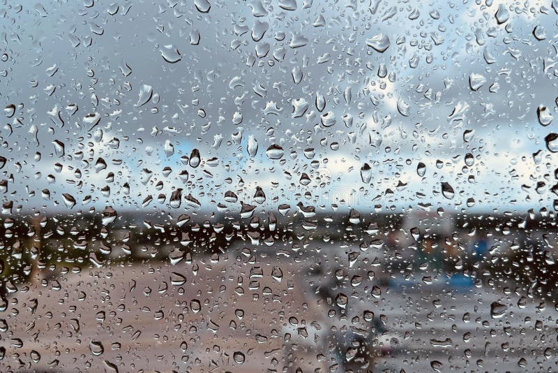 Rain Drops on the Clear Glass. Beautiful Raining Sky with City ...