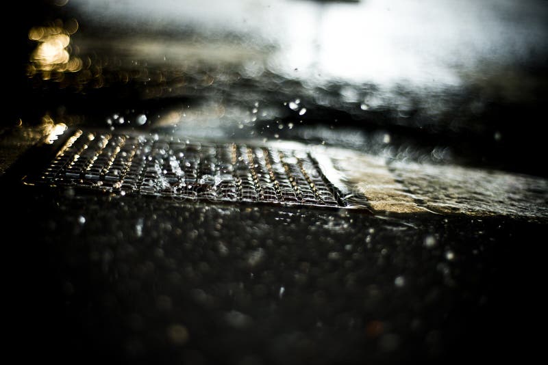 Rain Drops Falling on Pavement by Night Stock Image - Image of drops ...