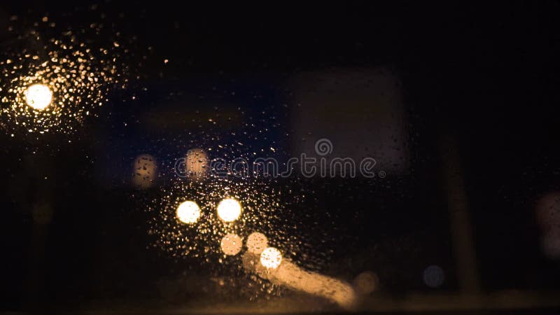 Rain Drops Falling on a Windshield of a Car and Wipers Moving Stock ...