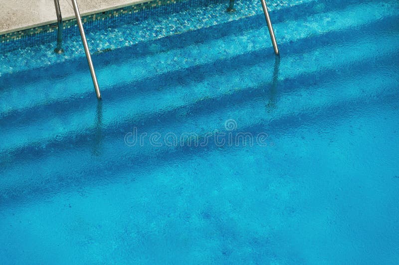Rain Drops Forming Circular Pattern at Outdoor Swimming Pool Water ...