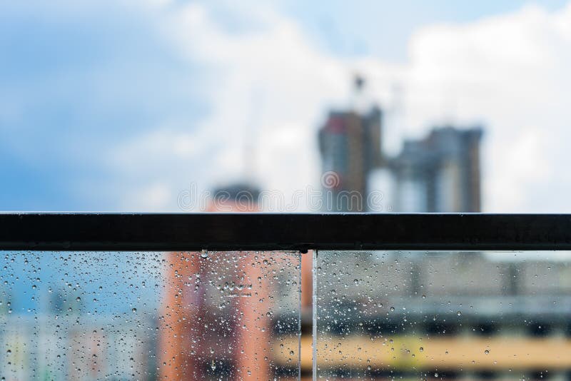 Rain Drops on Glass Balcony and Construction in Background Stock Image ...