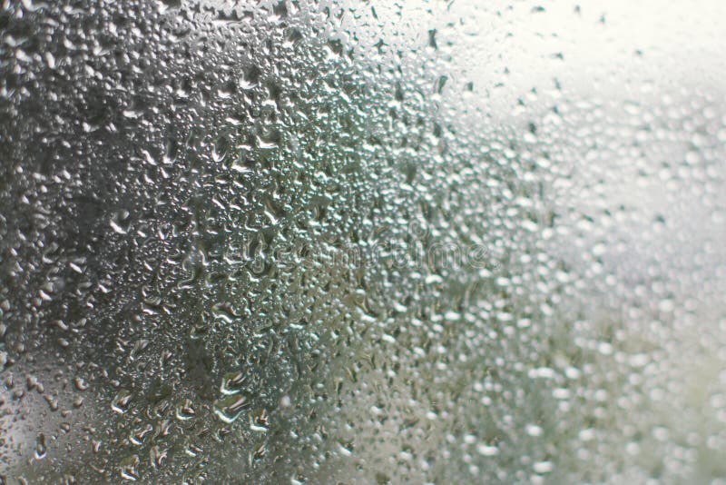 Rain drops on glass window stock photo. Image of rainy - 176943820