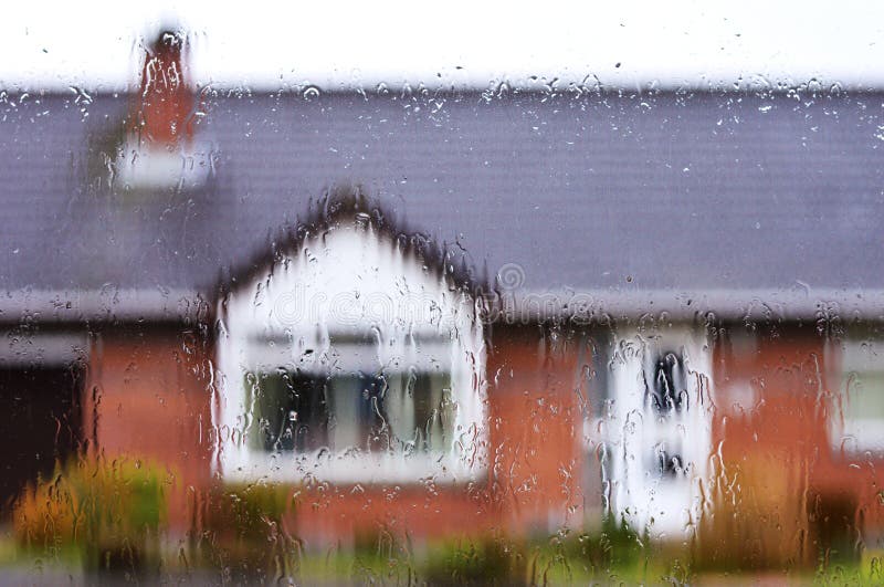 Rain Drops on Glass Window. House Blurred at Background Stock Image ...