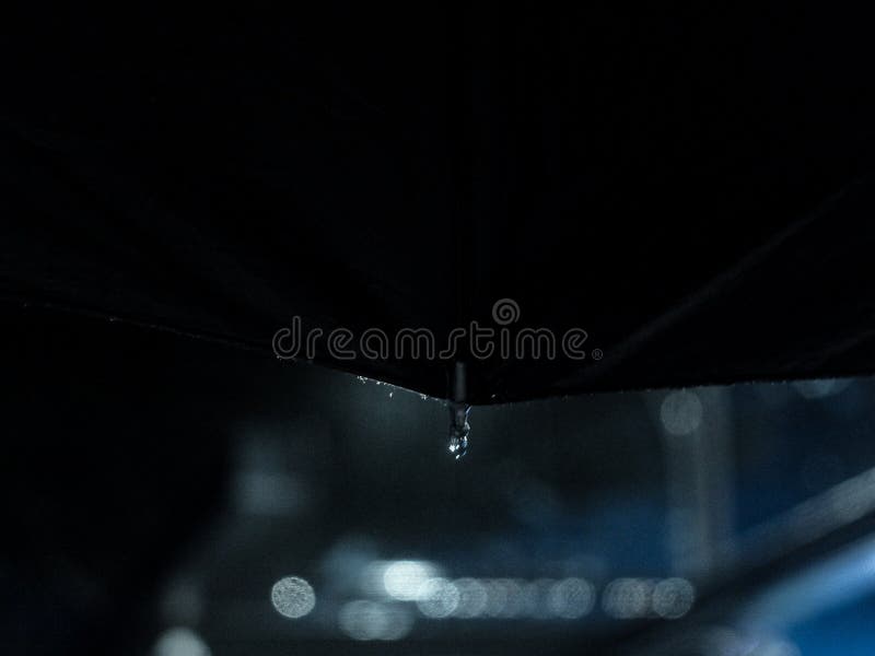 Rain drops at night stock image. Image of drop, darkness - 274759015