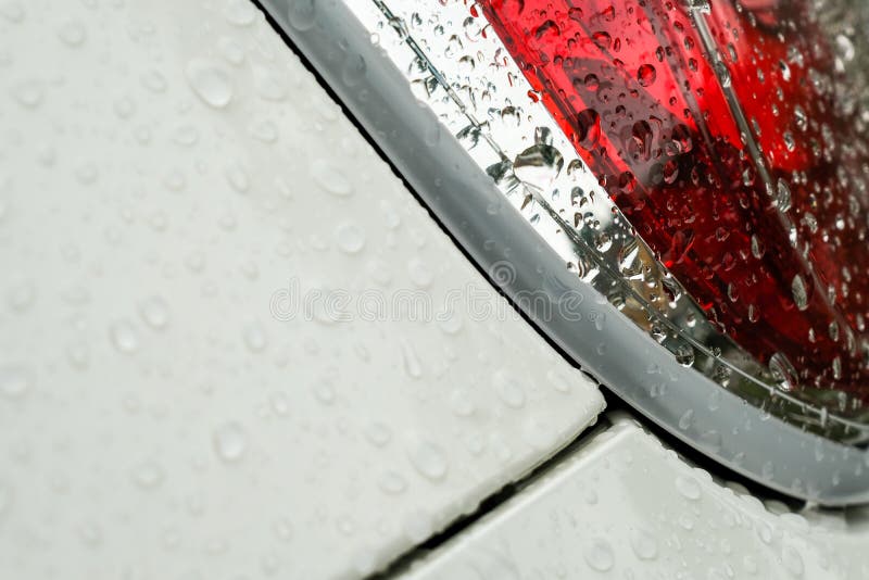 Rain Drops on Red Auto Brake Lights with White Metal Panels Stock Image ...