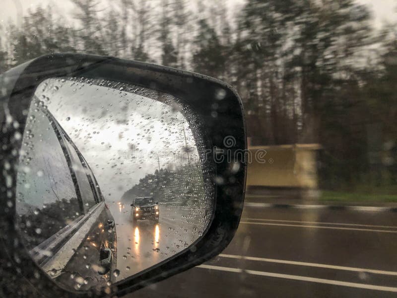 Rain Drops and Reflection of a Car on Mirror Stock Image - Image of ...