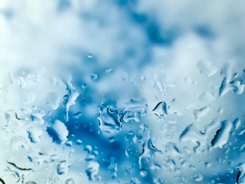 Rain Drops Running Down a Window in a Close Up View Stock Photo - Image ...