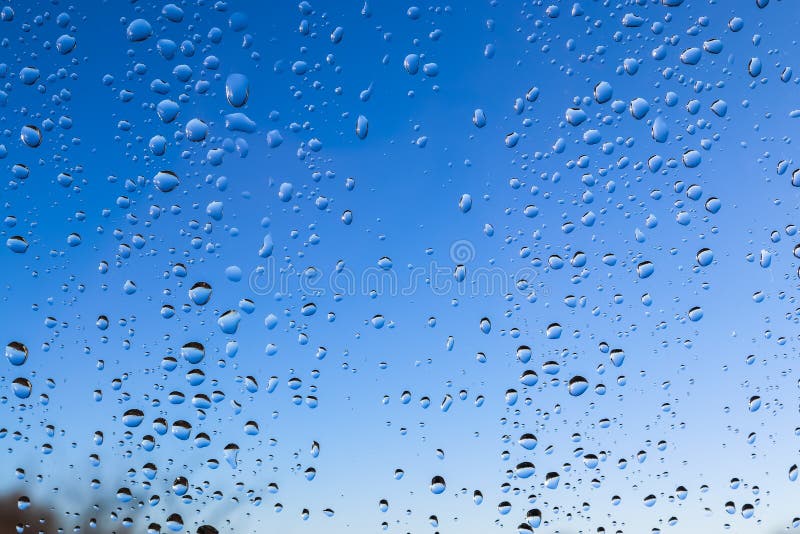 Rain Drops Running Down a Window in a Close Up View Stock Image - Image ...