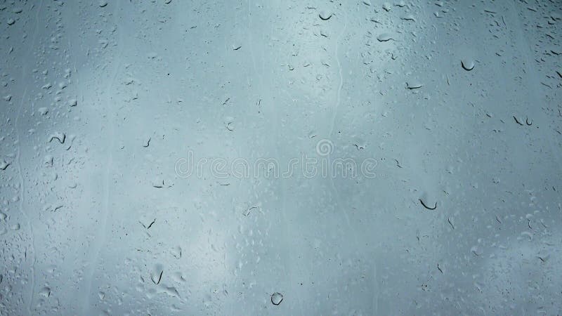 Rain Drops Running Down a Window in a Close Up View Stock Footage ...