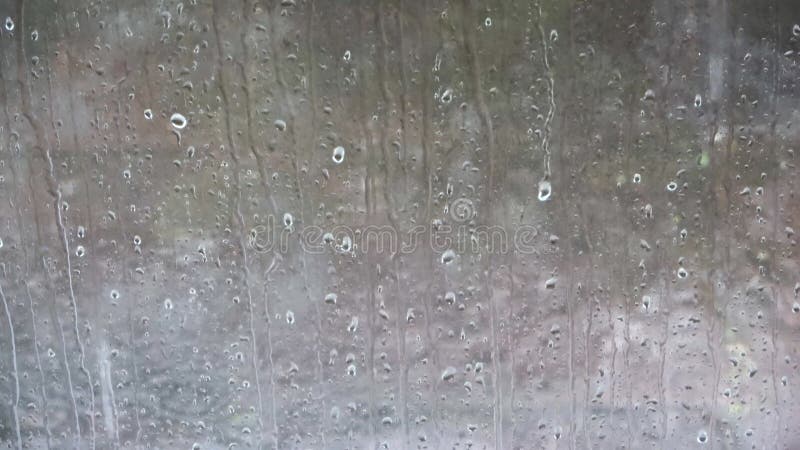 Rain Drops Running Down a Window in a Close Up View Stock Video - Video ...