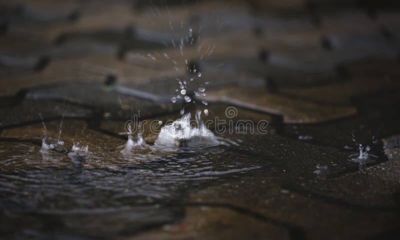 Rain Drops Splashing during Hard Rain Fall at Night. Stock Image ...
