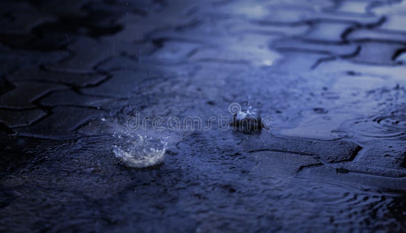 Rain Drops Splashing during Hard Rain Fall at Night. Stock Photo ...