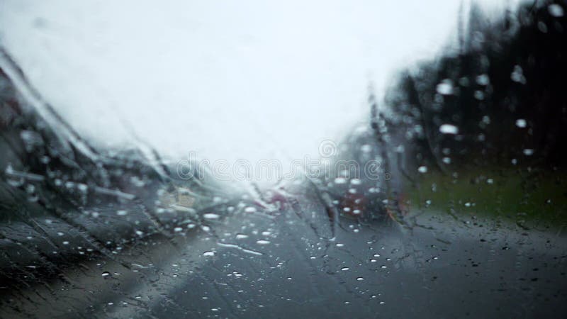 Rain Drops Splatters on Windshield during Rain Storm, Difficult Driving ...