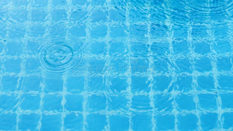 Rain Drops on the Swimming Pool. Stock Photo - Image of ocean, circle ...