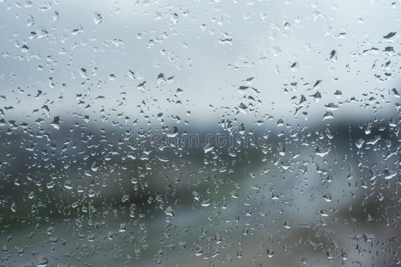 Rain Drops are Visible on a Window Glass, Creating a Textured Pattern ...