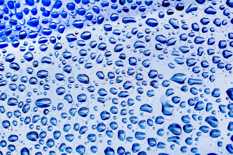 Rain Drops of Blue Color on the Window Glass. Natural Background Stock ...