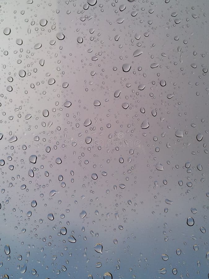 Rain drops on a window stock photo. Image of atmosphere - 46211240