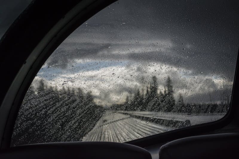 Rain covered train window stock photo. Image of dark - 119593152