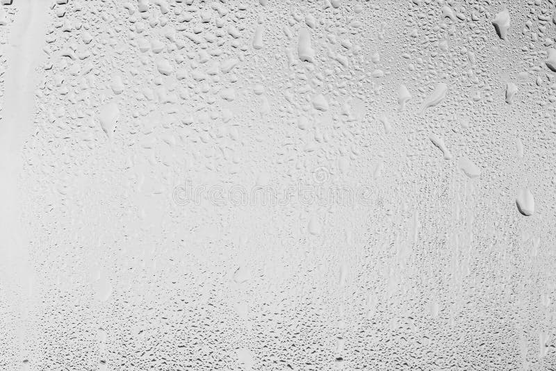 Rain Drops on Window Glasses Surface with Gray Sky Background . Natural ...