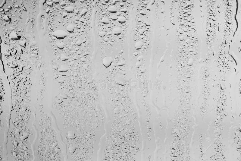 Rain Drops on Window Glasses Surface with Gray Sky Background . Natural ...