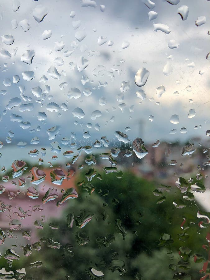 Rain Drops on a Window Pain Against City View Stock Image - Image of ...