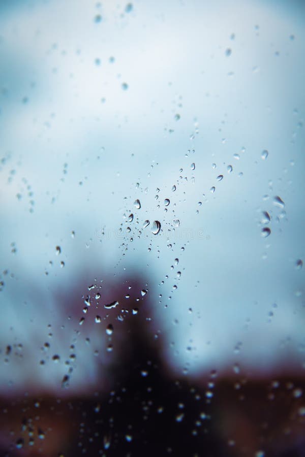 Rain Drops on a Window Surface with Blurry Shadows Stock Photo - Image ...