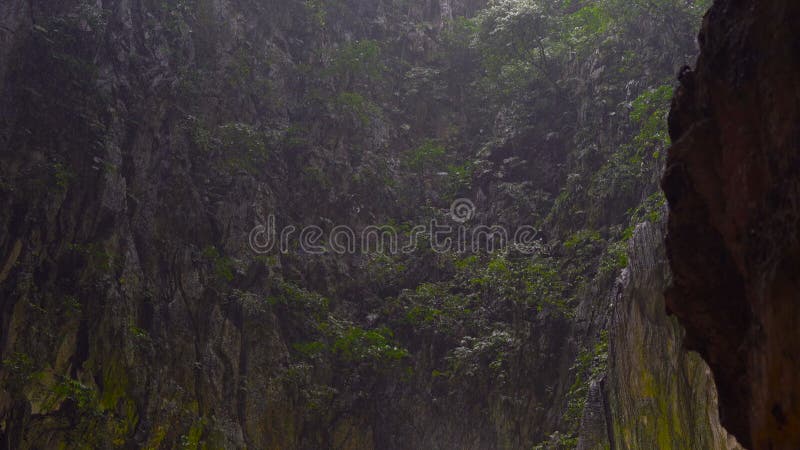Rain Falling Down Incide of a Huge Batu Caves in Malaysia Having a ...