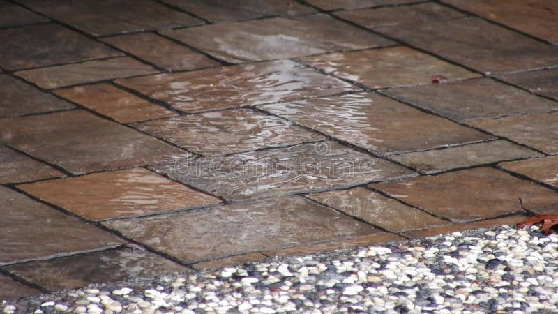 Rain Falling on Stone Paver Driveway with Rock Walkway Stock Video ...