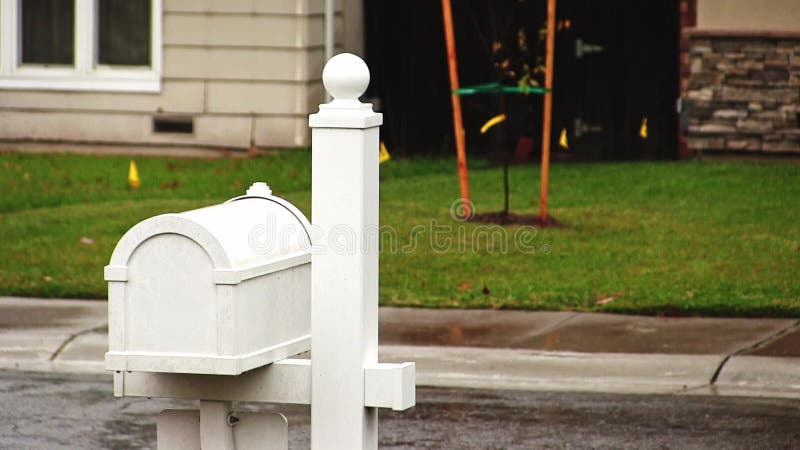 Rain Falling on White Mailbox with Street Sidewalk Grass Stock Footage ...