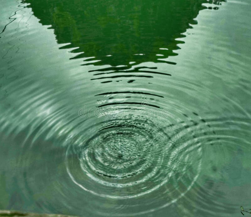 The Rain Falls on the River Water, Forming Waves with Large Circles ...