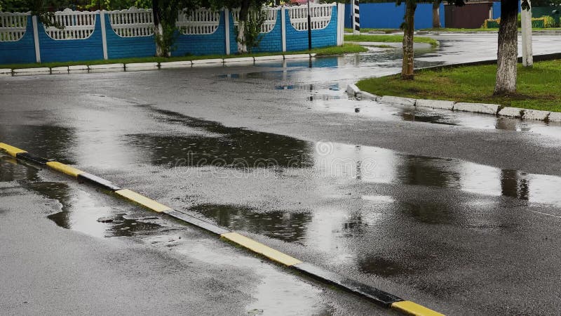 Rain Falls on Wet Asphalt with Road Markings Stock Footage - Video of ...