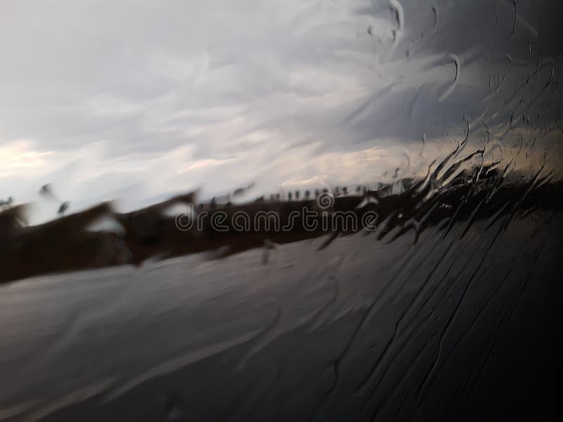 Rain on the glass window stock photo. Image of drop - 201165496