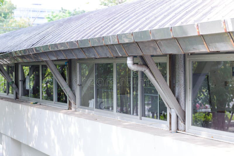 Rain Gutter with Down Pipe on Rooftop of Building Stock Photo - Image ...