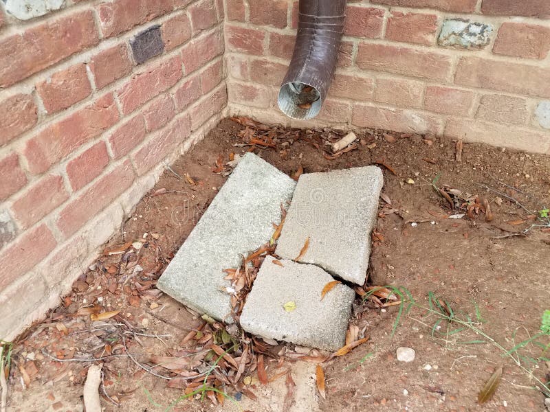Rain Gutter Downspout and Cement Slab with Brick Wall Stock Photo ...