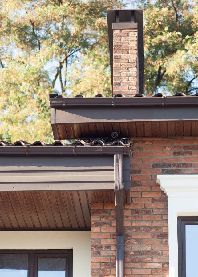 Rain Gutter on a Modern Brick House with Plastic Windows. Stock Photo ...