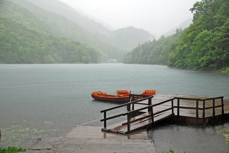 Rain on the lake stock image. Image of dock, coast, country - 20434095